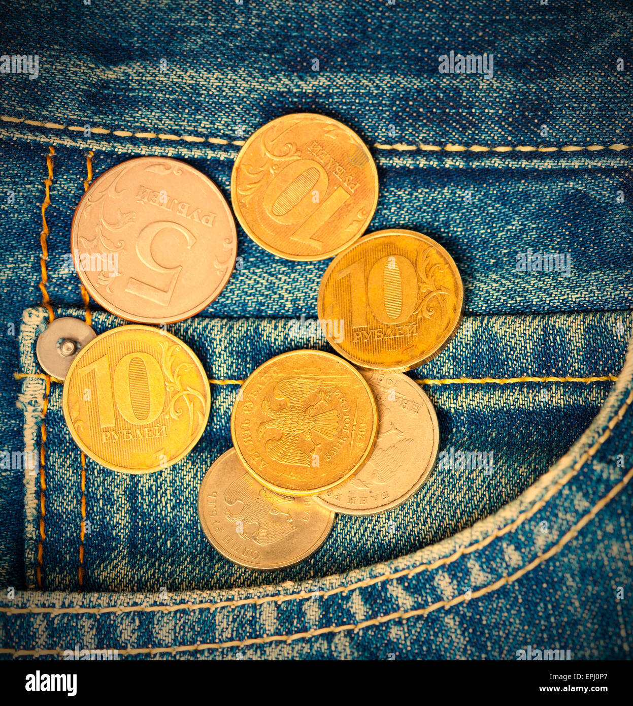 Coins and pocket jeans Stock Photo - Alamy