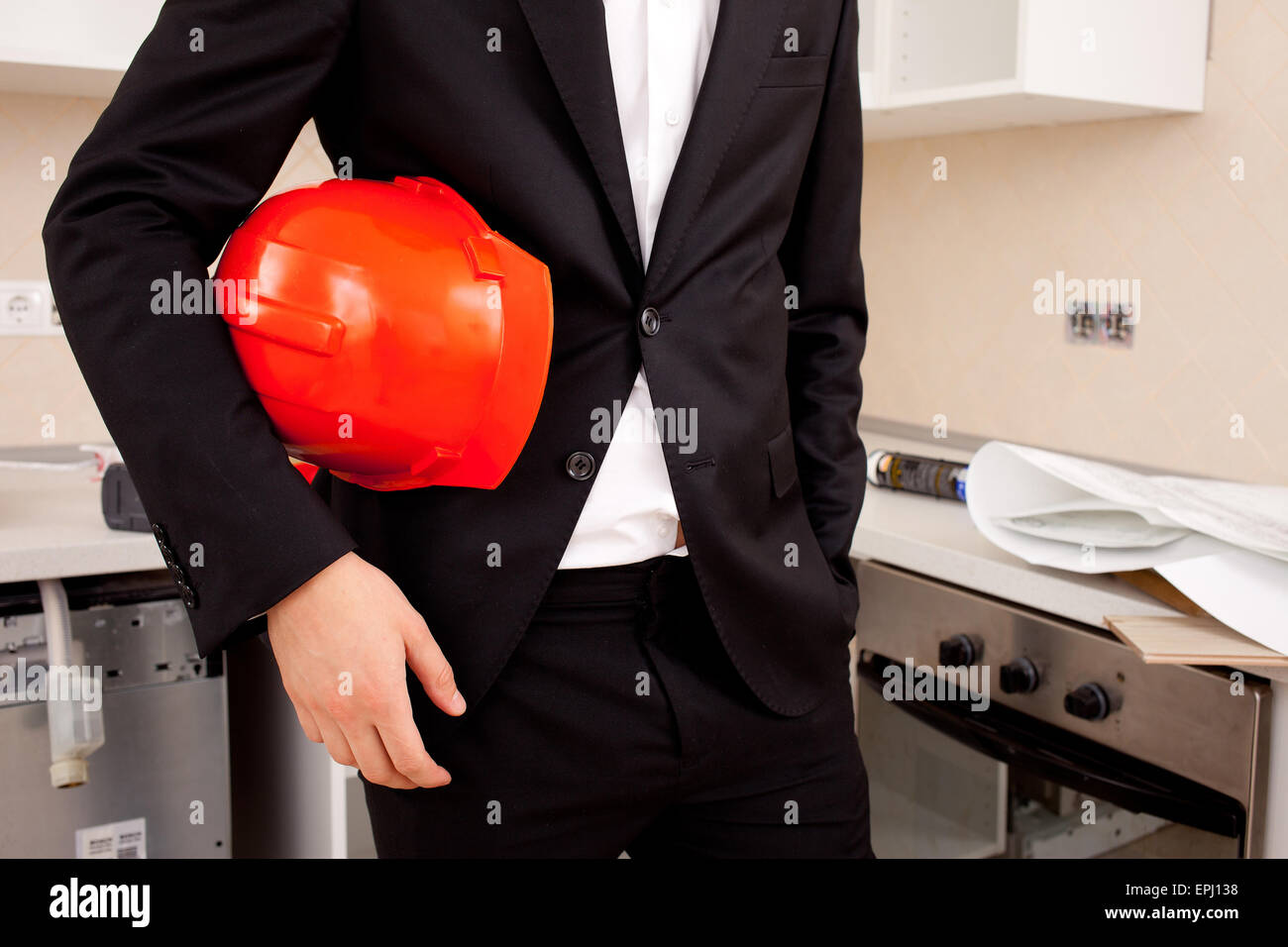 engineer holding red helmet Stock Photo - Alamy