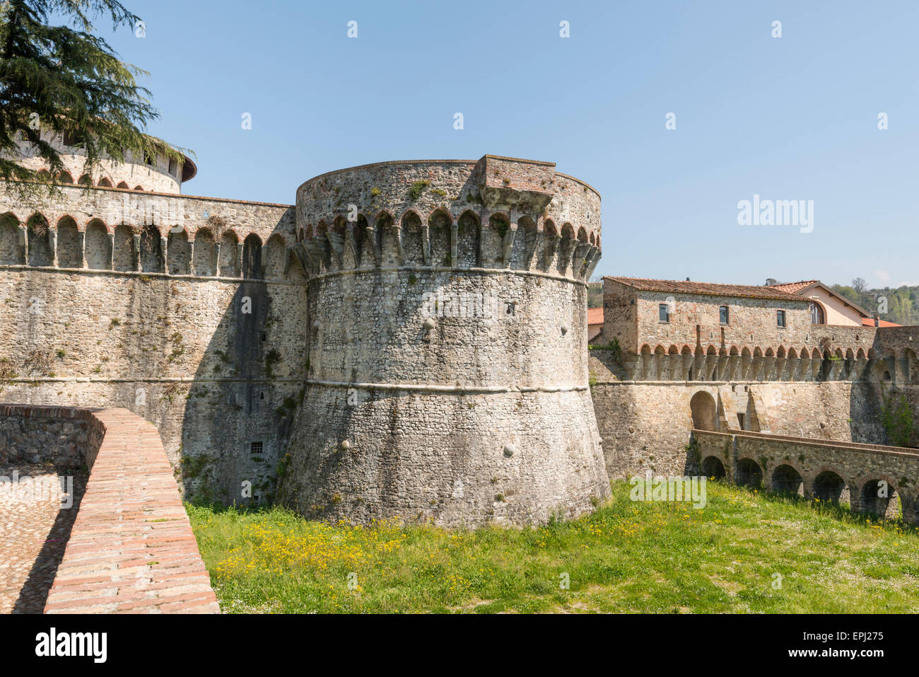 view of walls , round dungeon and stone arched bridge on ancient Castle ...