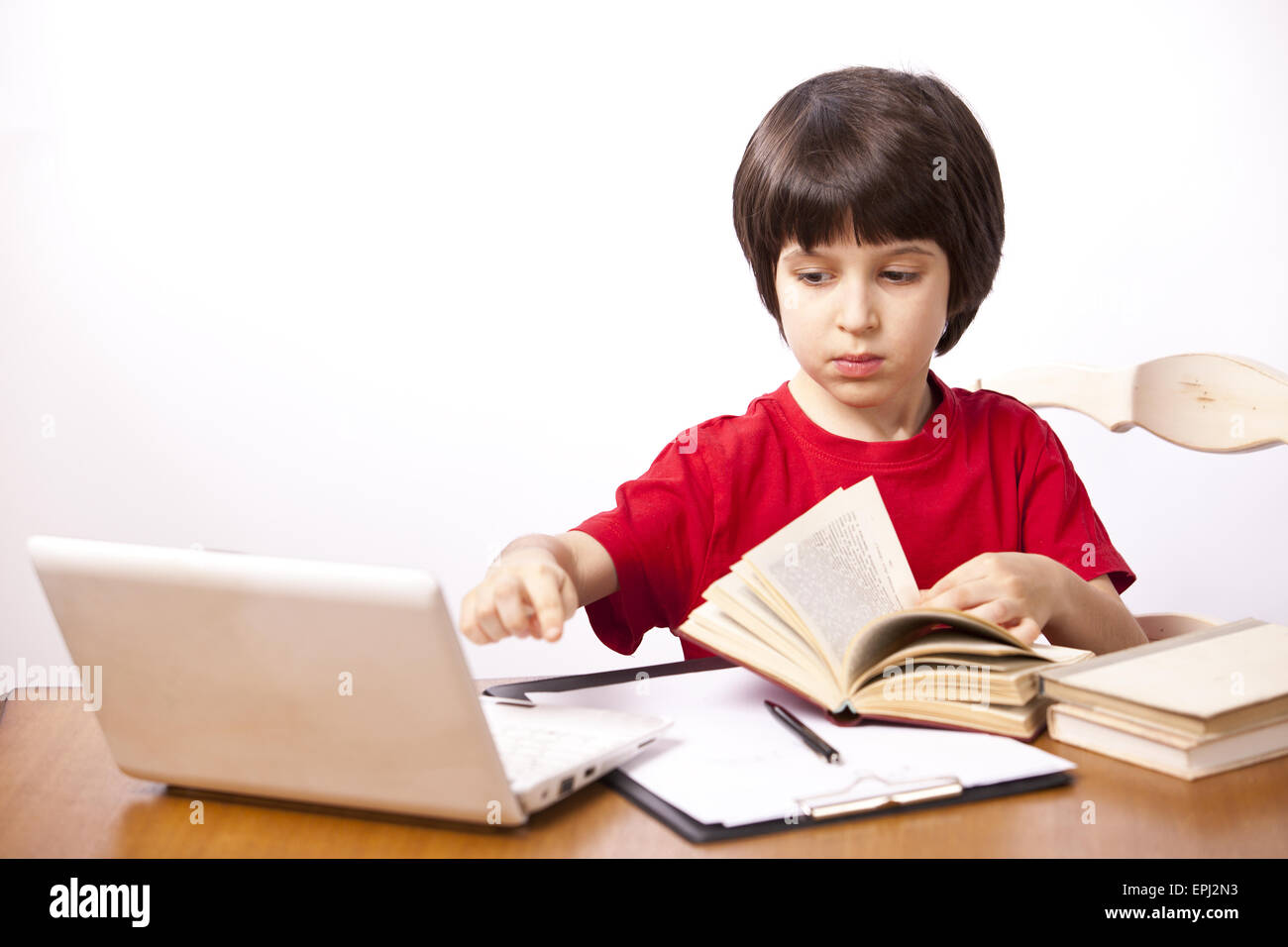 schoolboy doing homework Stock Photo - Alamy