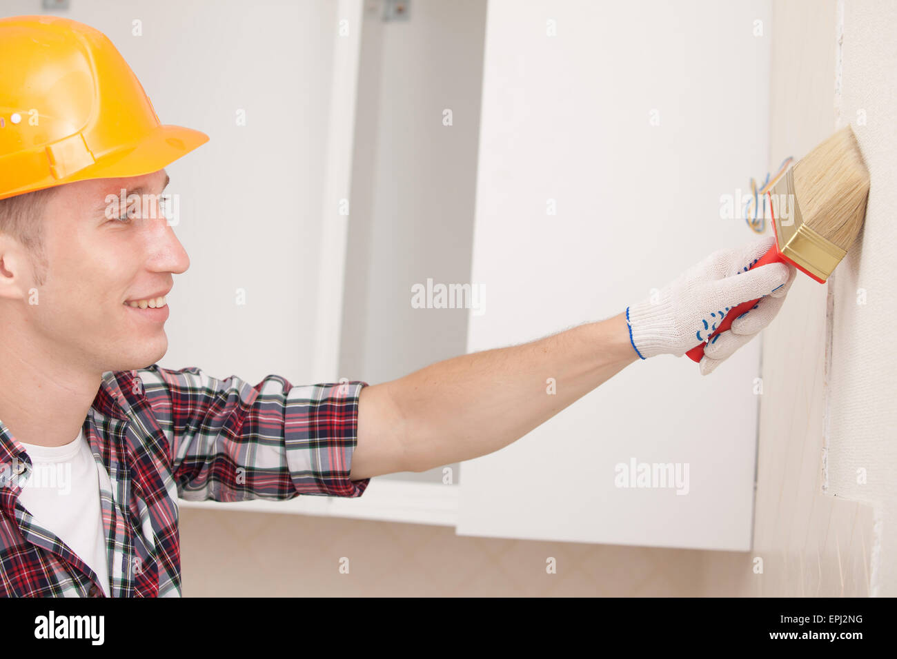 worker with paint brush Stock Photo - Alamy
