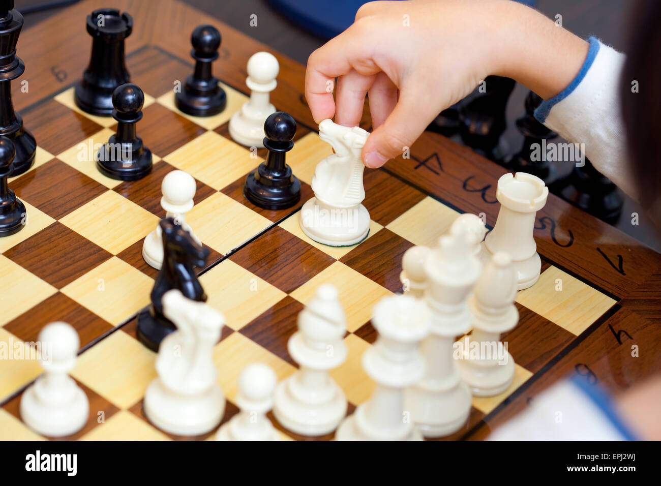 Child boy playing chess hi-res stock photography and images - Alamy