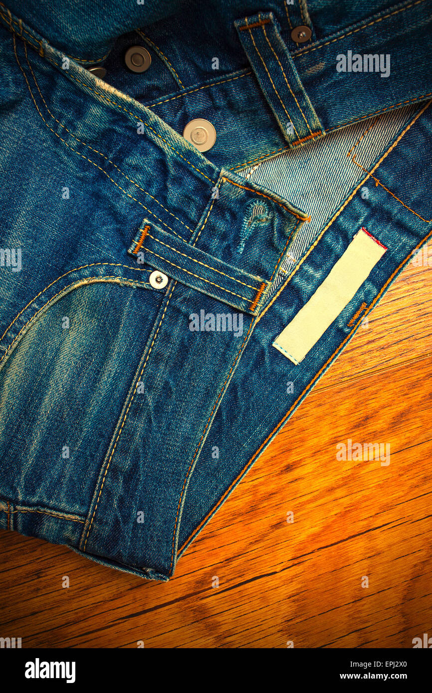 old unbuttoned jeans Stock Photo - Alamy