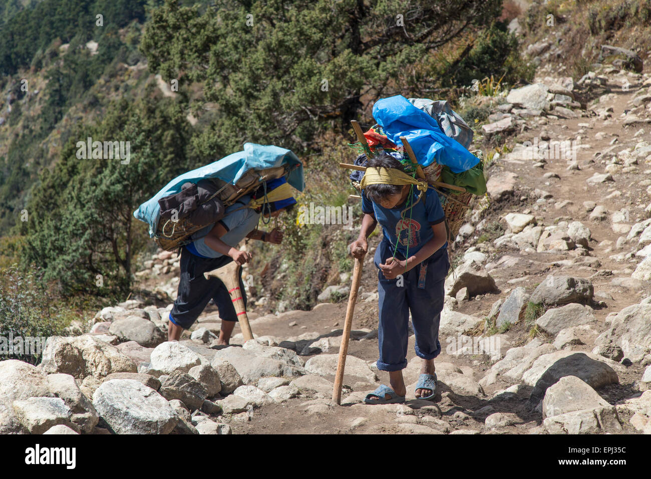 Sherpas with heavy load hi-res stock photography and images - Alamy