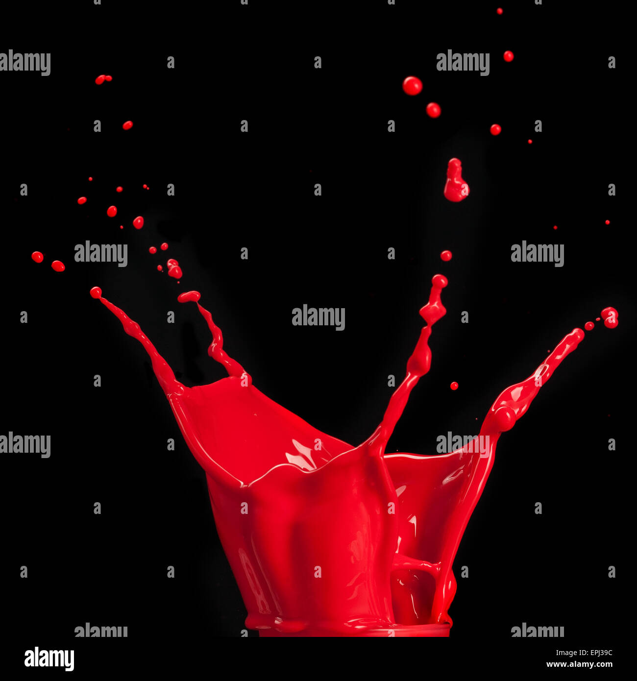 splash of red paint isolated on black Stock Photo - Alamy