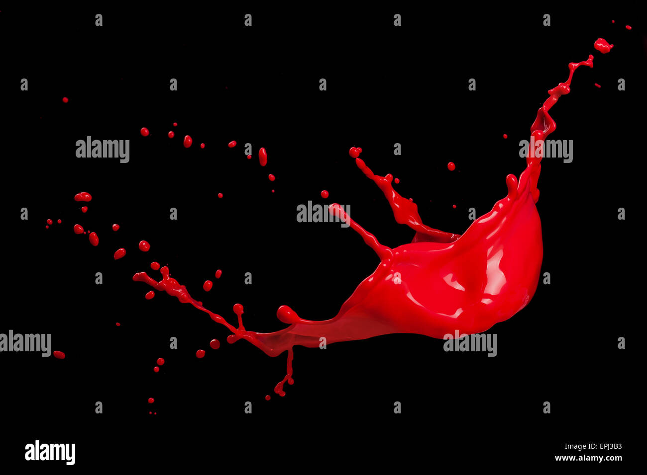 splash of red paint isolated on black Stock Photo - Alamy