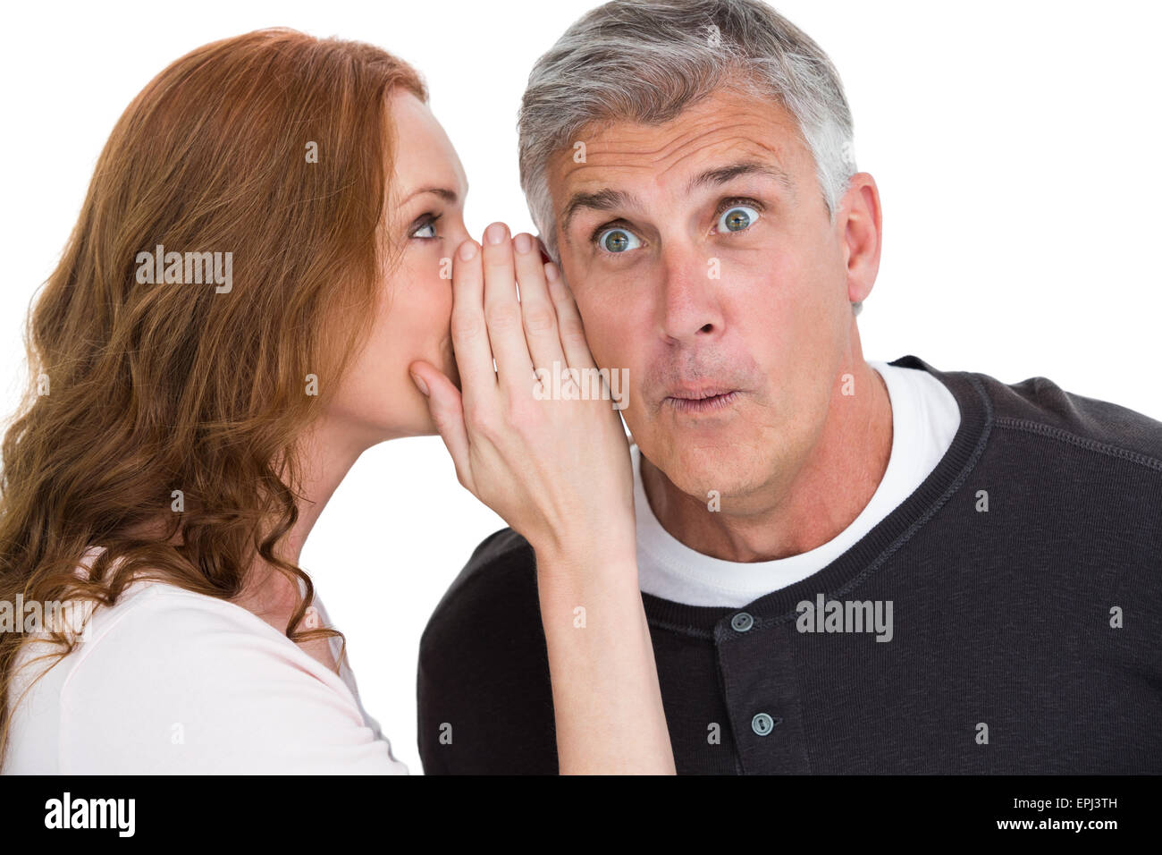 Woman telling secret to her partner Stock Photo - Alamy
