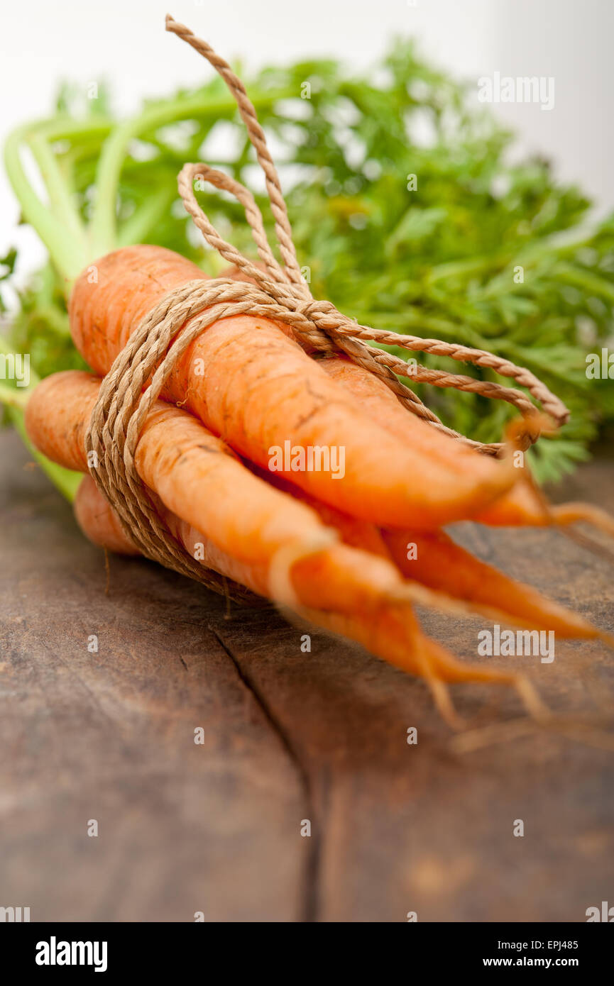 baby carrots bunch tied with rope Stock Photo - Alamy