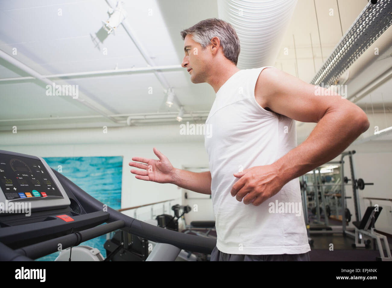 Fit man working out on treadmill Stock Photo - Alamy