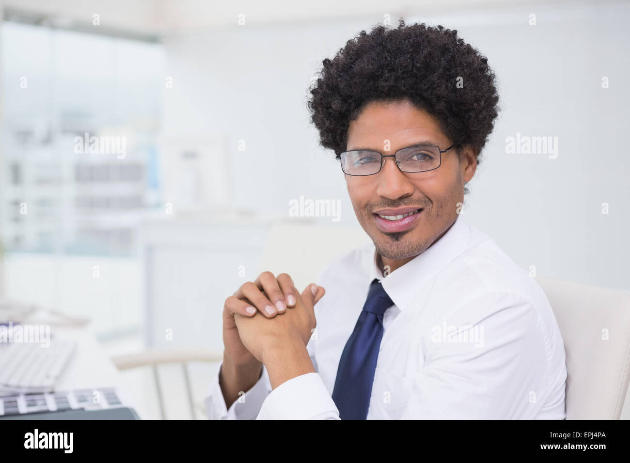Handsome photo editor working at desk Stock Photo - Alamy