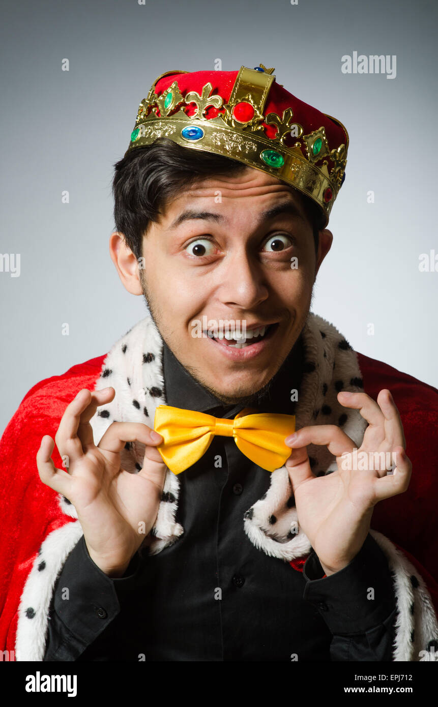Concept with funny man wearing crown Stock Photo - Alamy