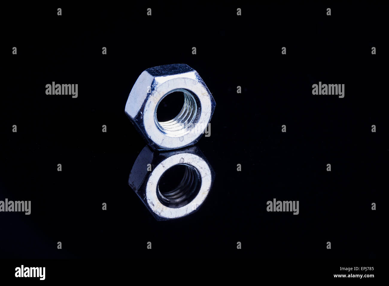 Shiny metal Nut isolated on black background Stock Photo - Alamy
