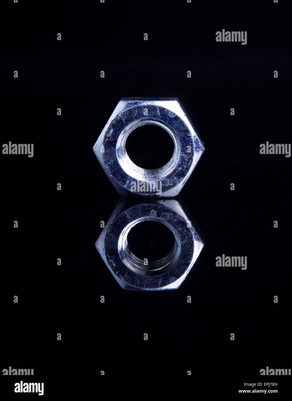 Shiny metal Nut isolated on black background Stock Photo - Alamy
