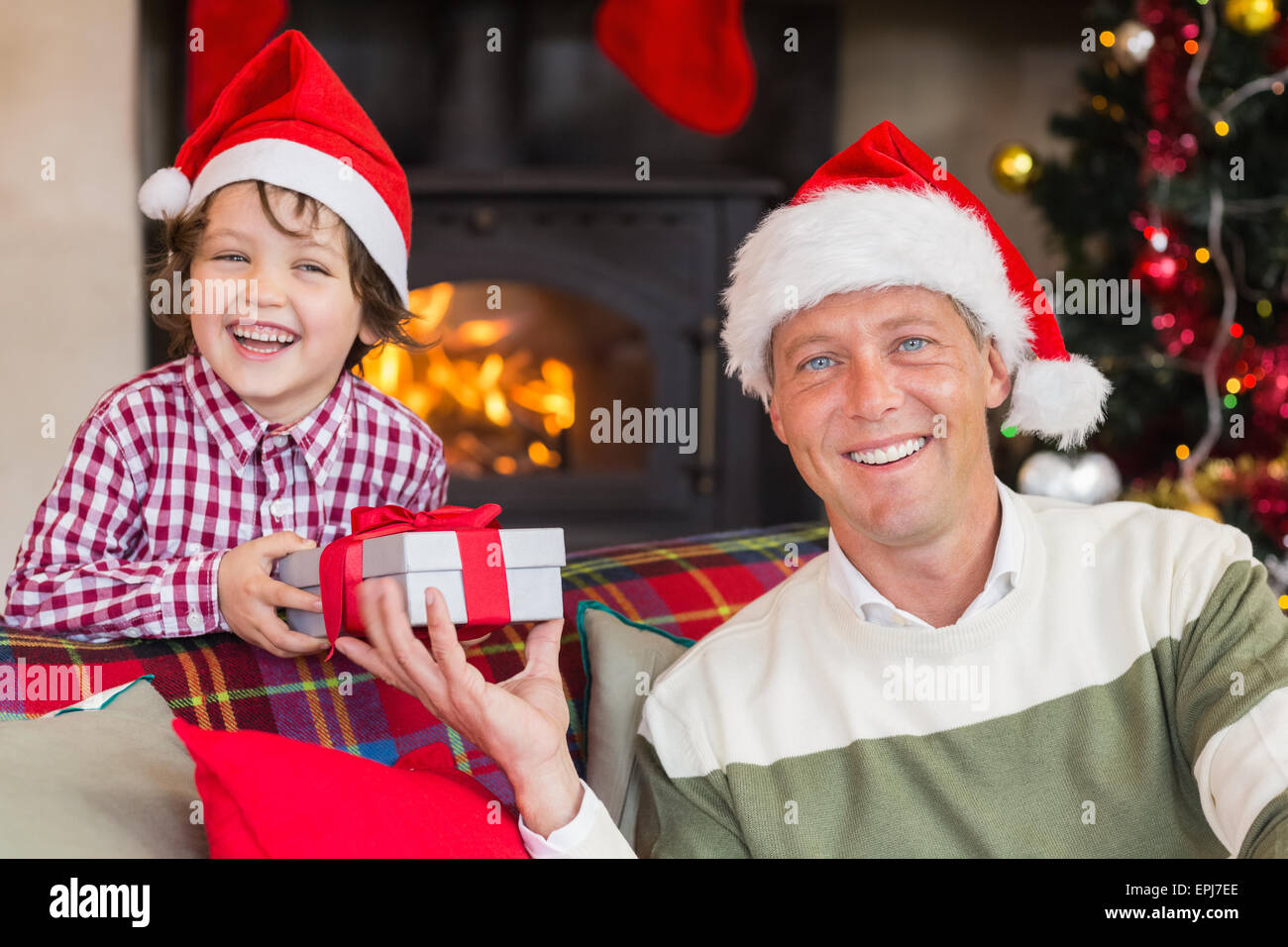 Father son opening christmas hi-res stock photography and images - Alamy