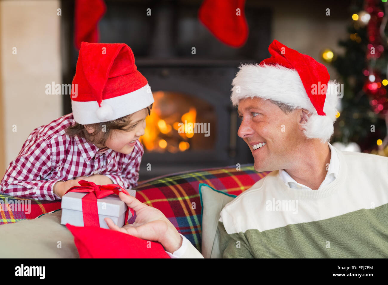 Father giving his son a christmas present Stock Photo - Alamy