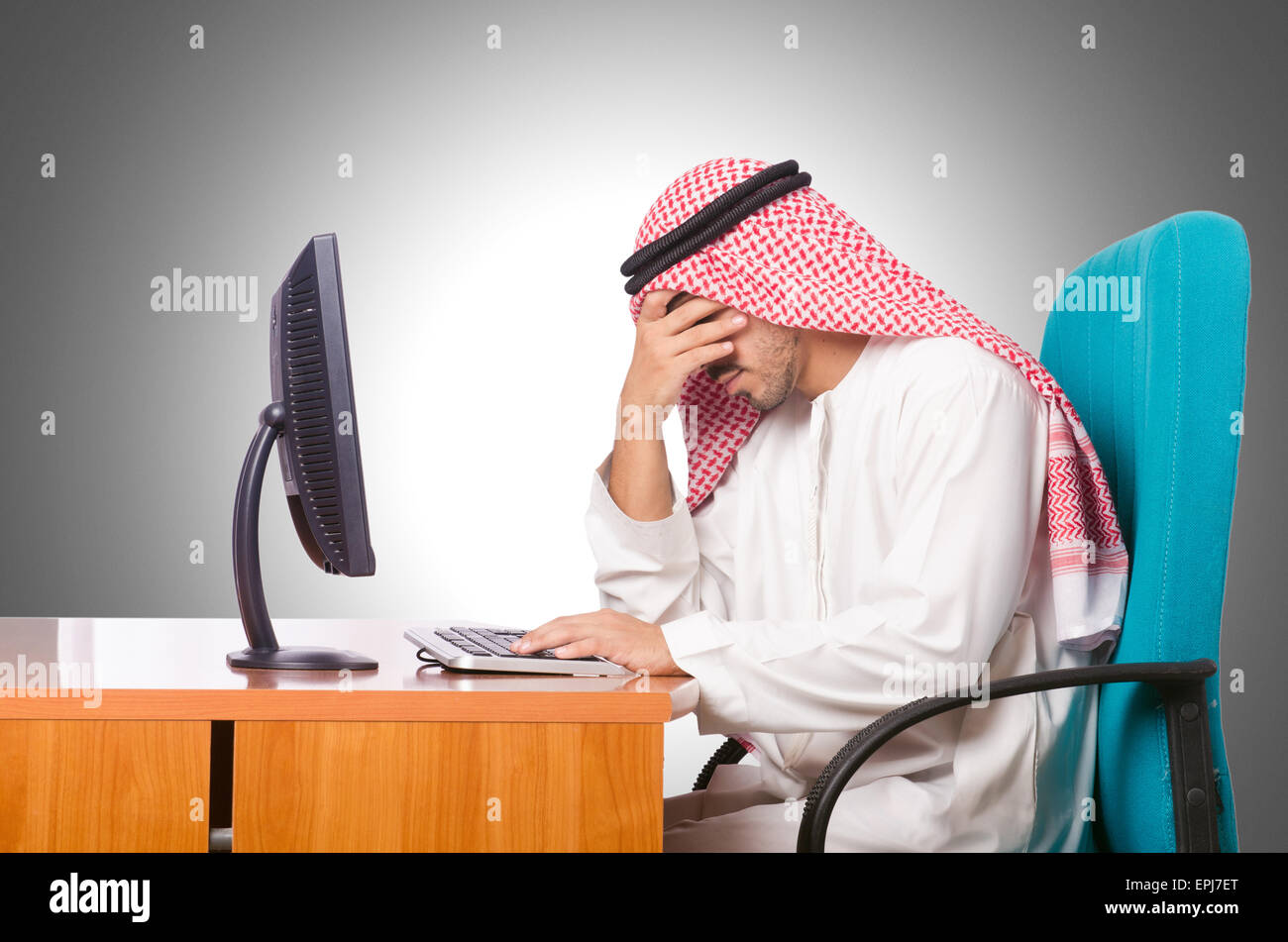 Arab businessman working on computer Stock Photo - Alamy