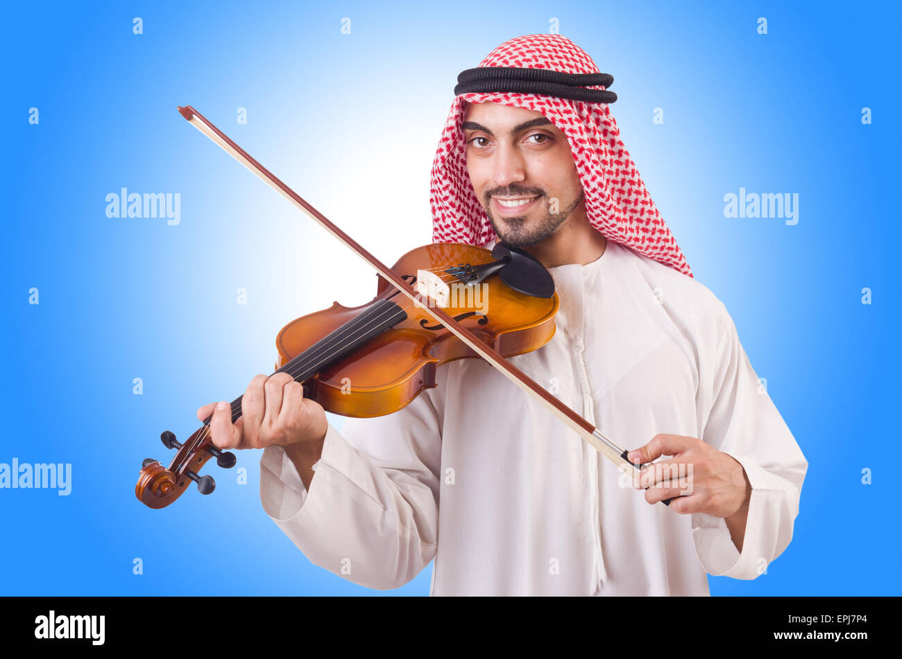 Arab man playing music on white Stock Photo - Alamy