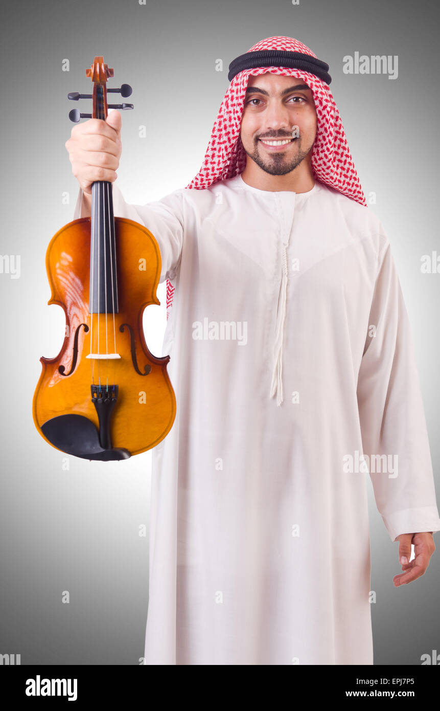 Arab man playing music on white Stock Photo - Alamy