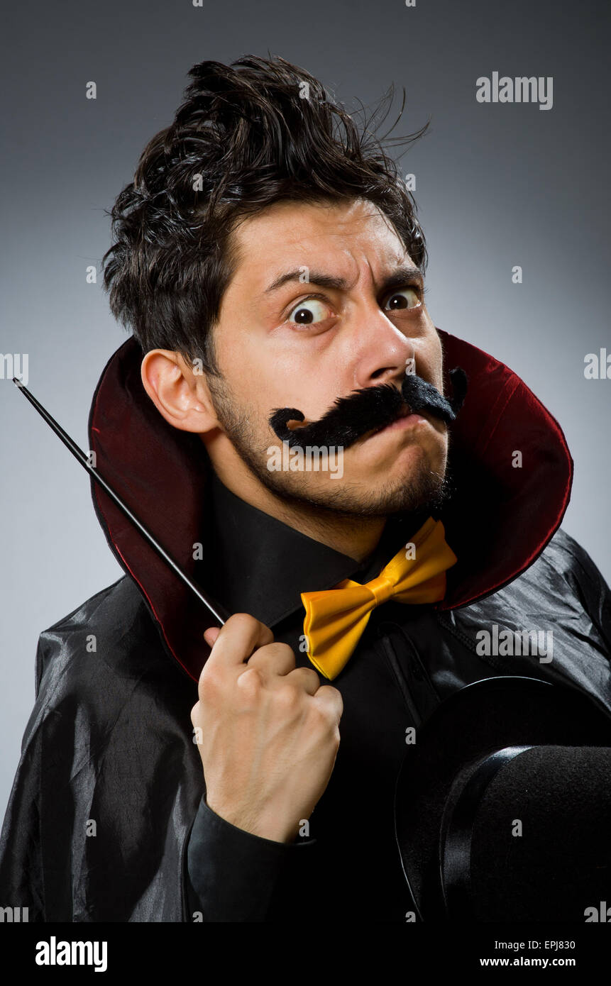 Funny magician man with wand and hat Stock Photo - Alamy