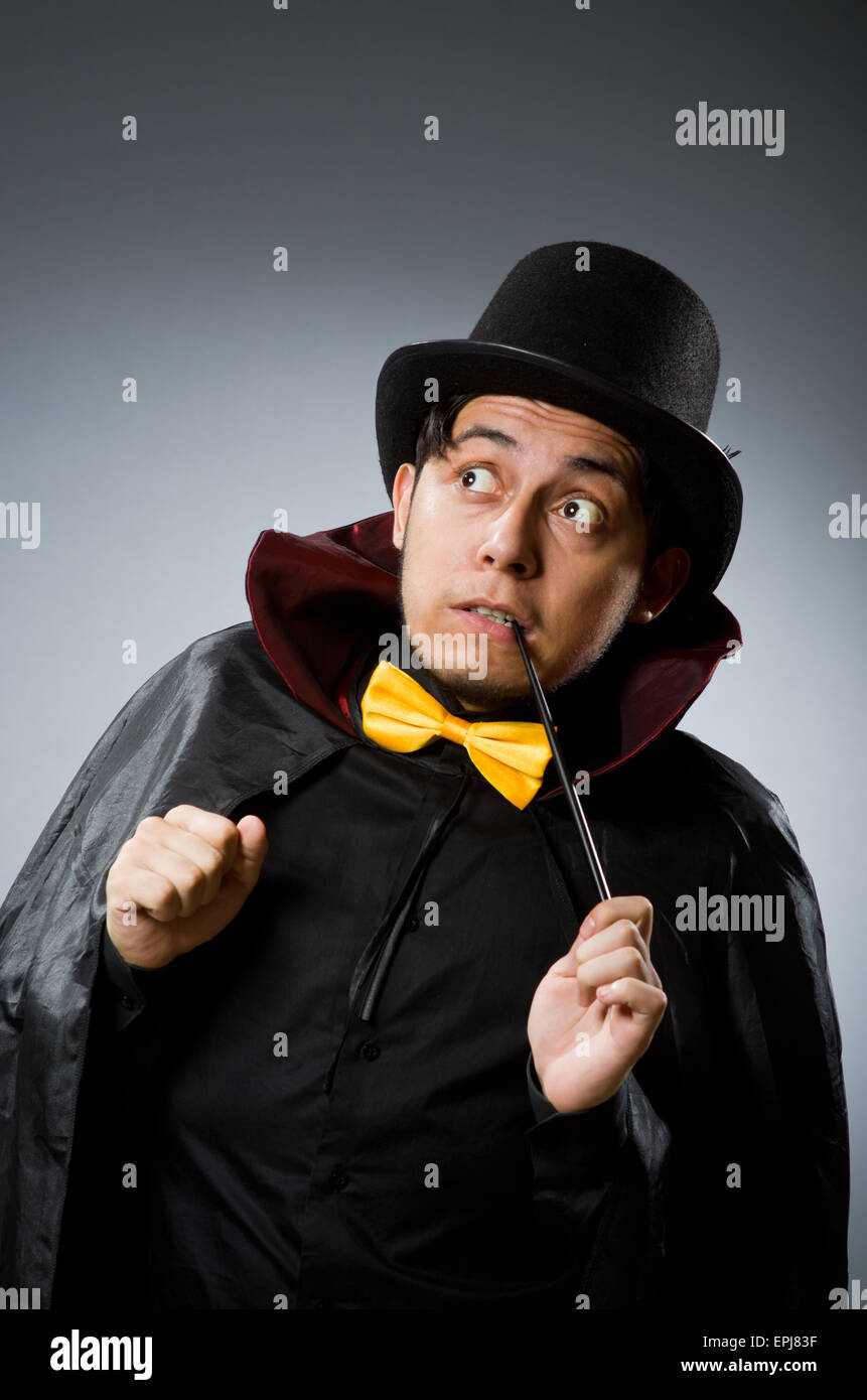 Funny magician man with wand and hat Stock Photo - Alamy