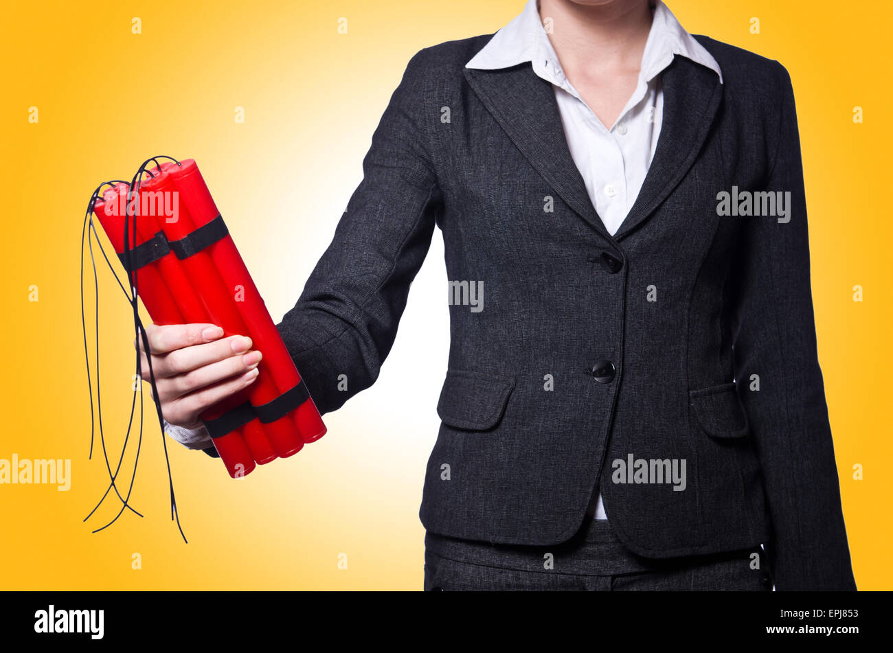 Hand holding bars of dynamite on white Stock Photo - Alamy