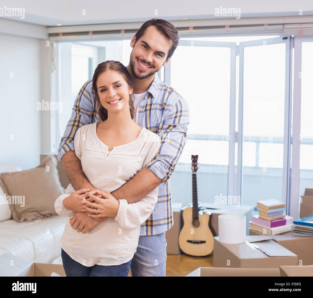 Cute couple hugging and smiling at camera Stock Photo - Alamy
