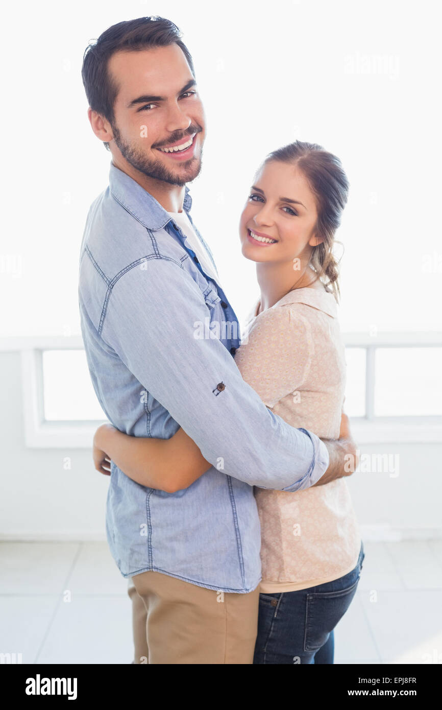 Cute couple hugging and smiling Stock Photo - Alamy