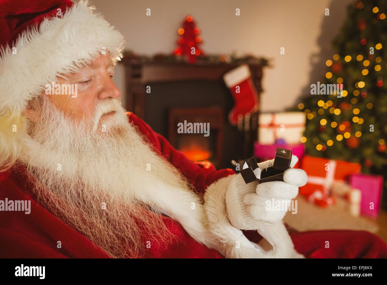Santa claus holding engagement ring hi-res stock photography and images ...