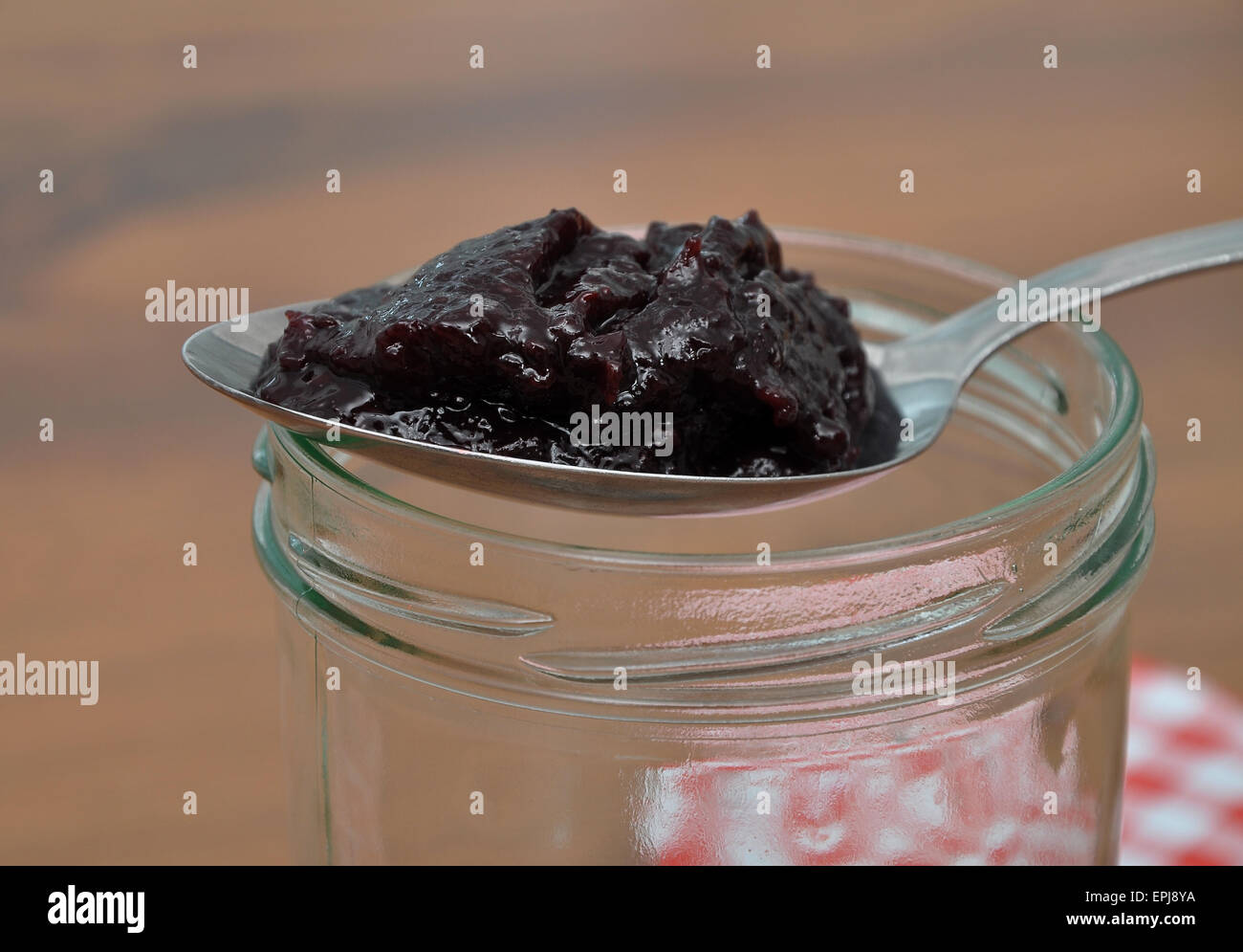 Spoon with jam Stock Photo - Alamy