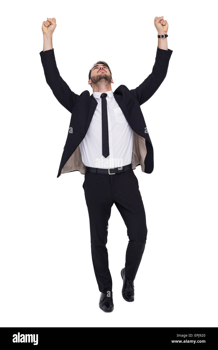 Cheerful businessman with arms up cheering Stock Photo - Alamy