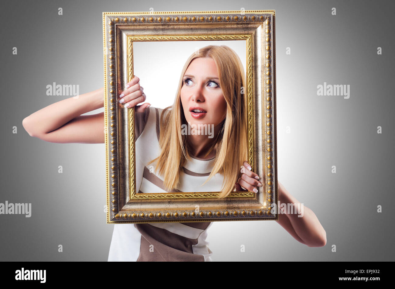 Woman with picture frame on white Stock Photo - Alamy