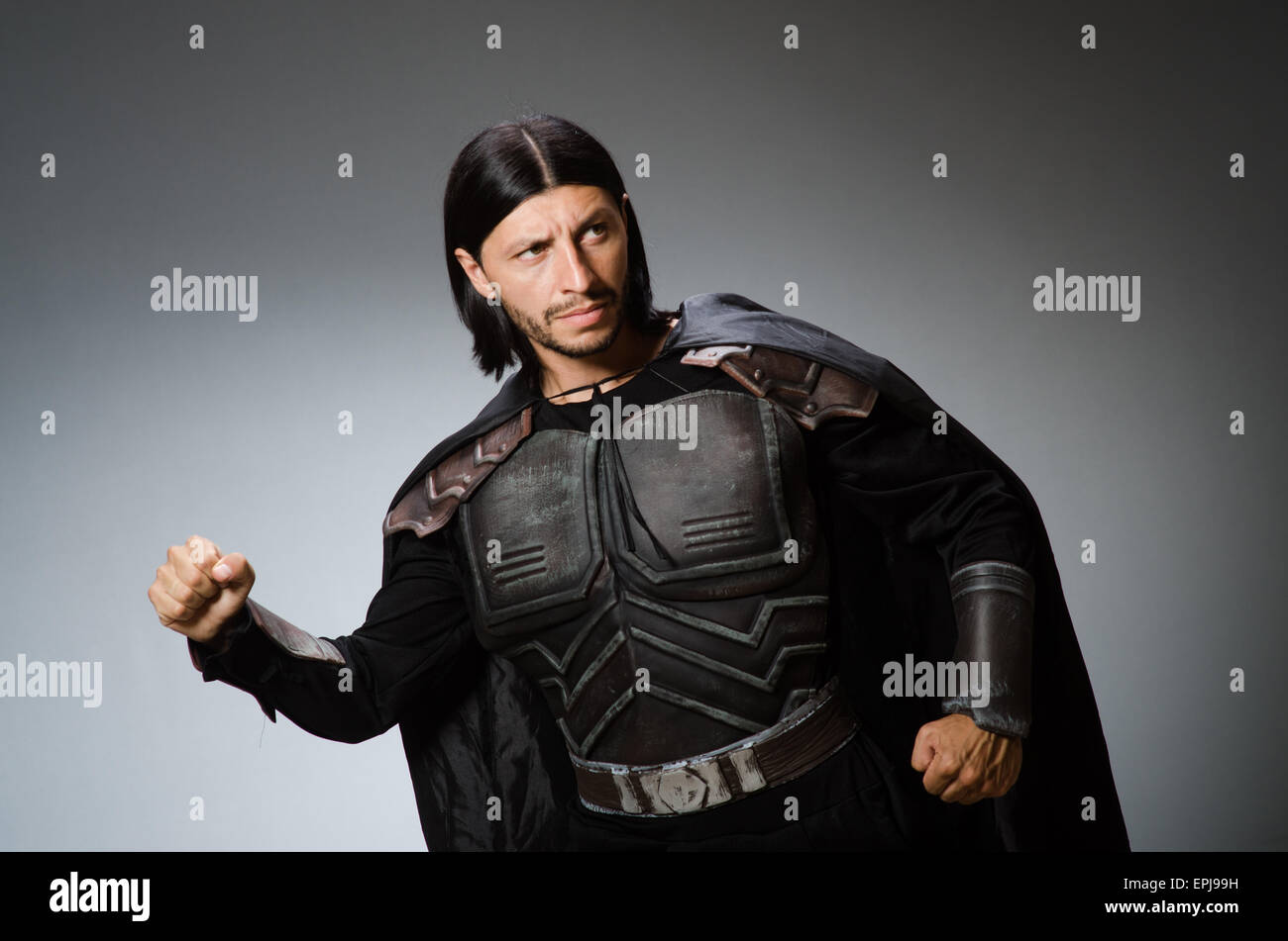 Angry warrior against dark background Stock Photo - Alamy