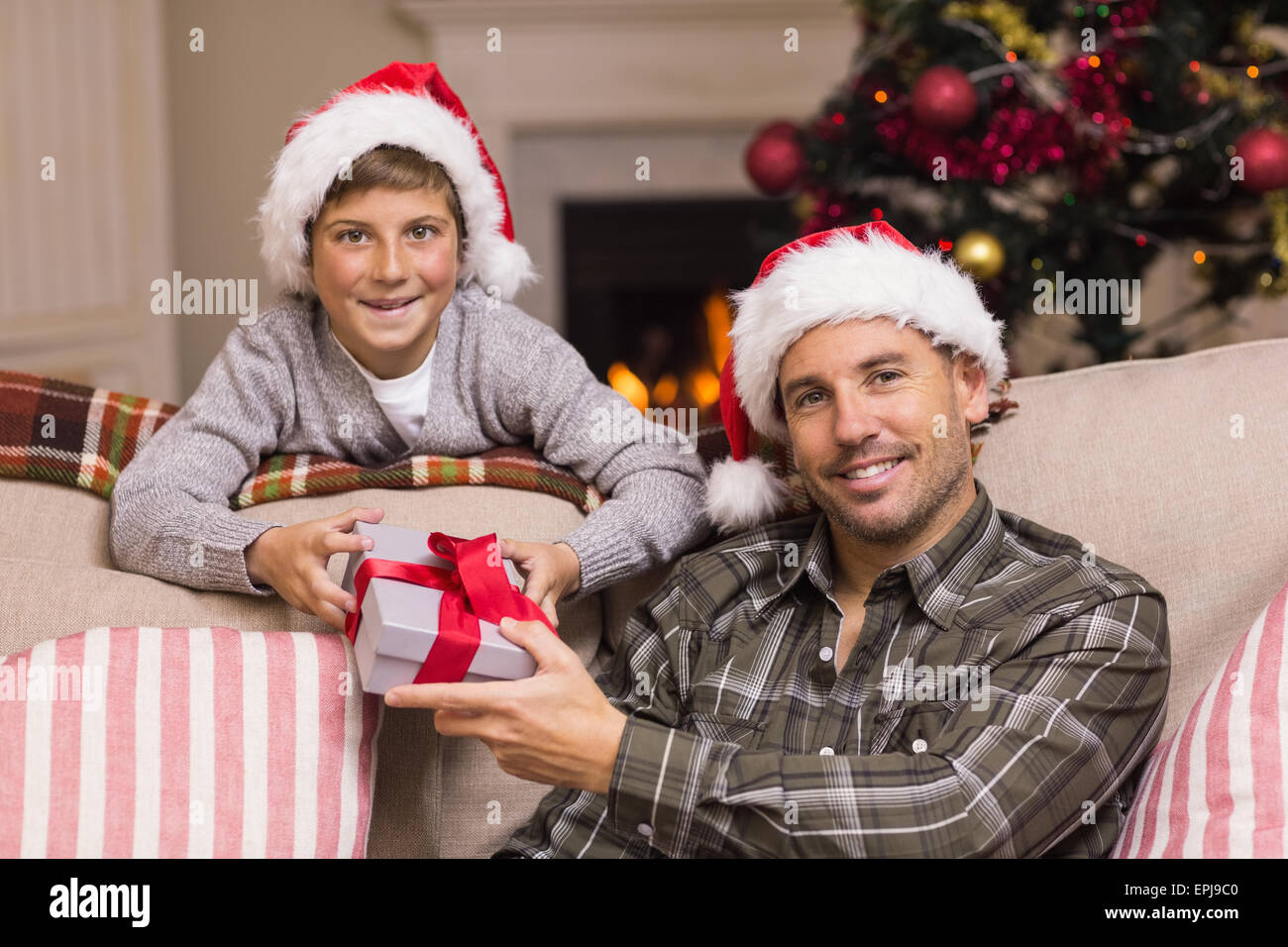Father time man giving gift to son hi-res stock photography and images ...