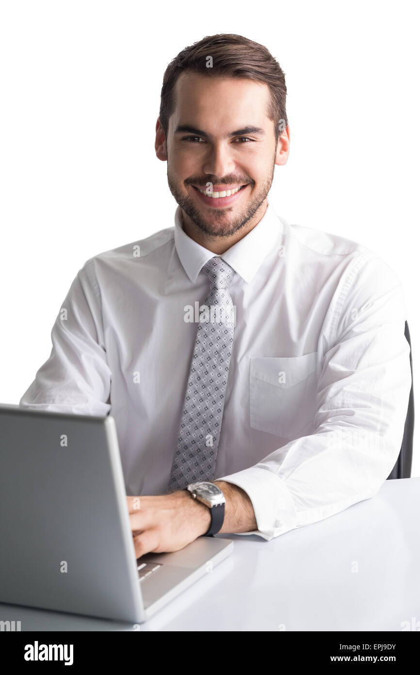 Happy businessman using his laptop Stock Photo - Alamy