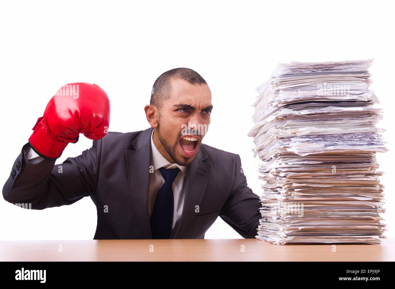 Angry businessman with stack of papers Stock Photo - Alamy