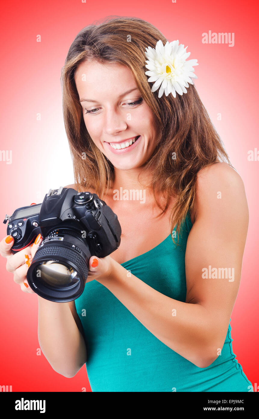 Attractive female photographer on white Stock Photo - Alamy