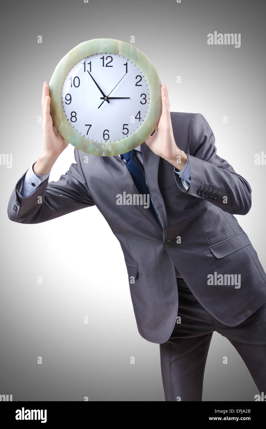 Man with clock isolated on white Stock Photo - Alamy