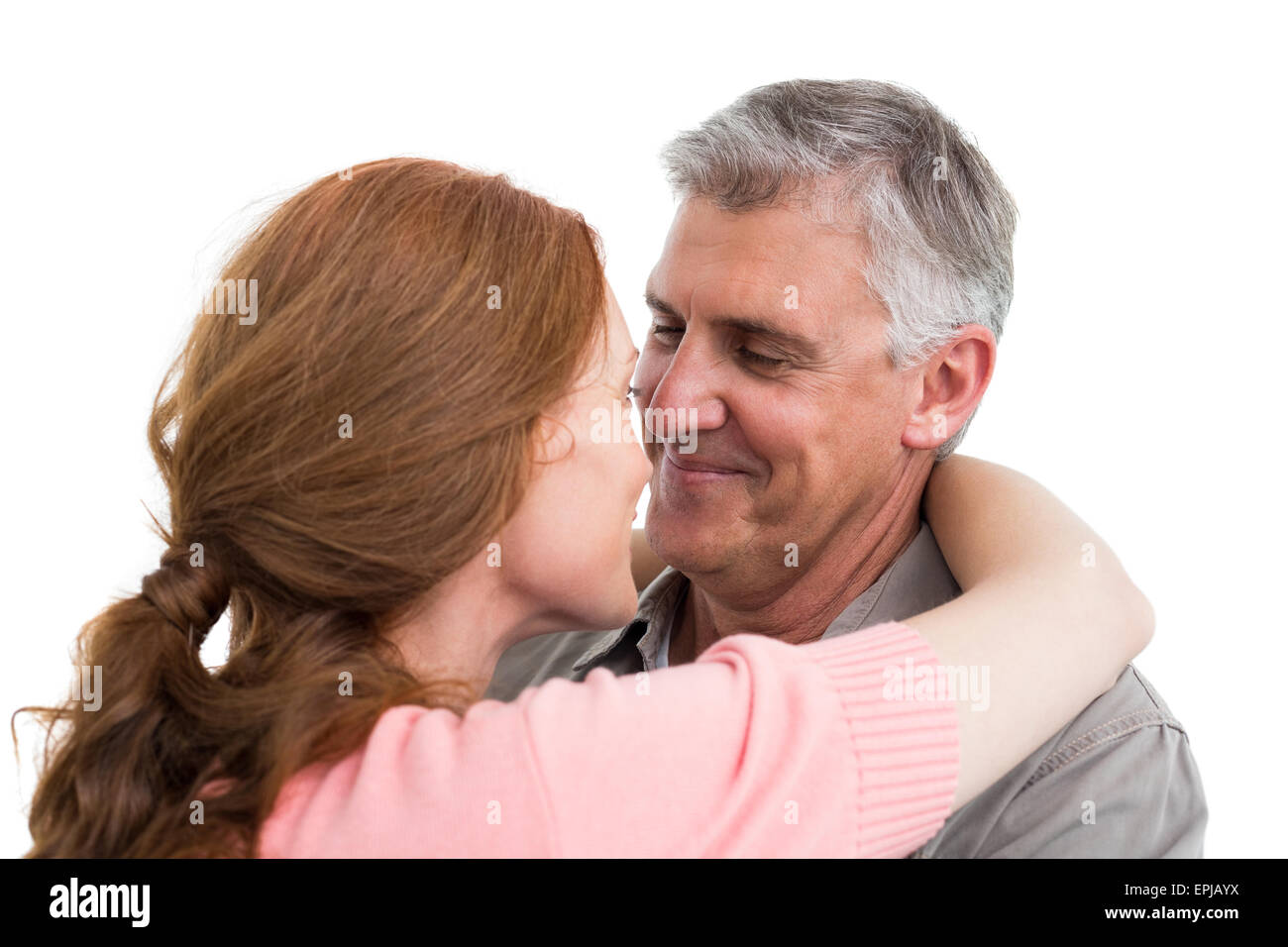 Casual couple hugging and smiling Stock Photo - Alamy