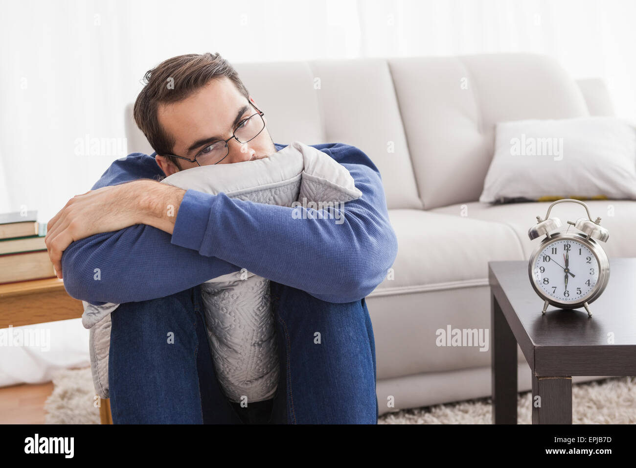 Depressed young man looking at camera Stock Photo - Alamy