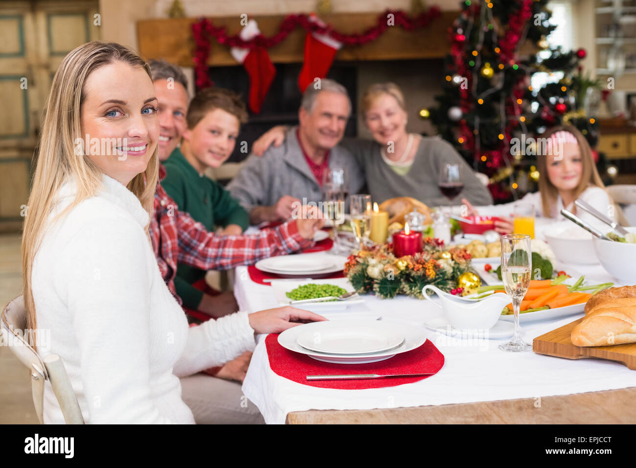 Three generation family having christmas dinner together Stock Photo ...