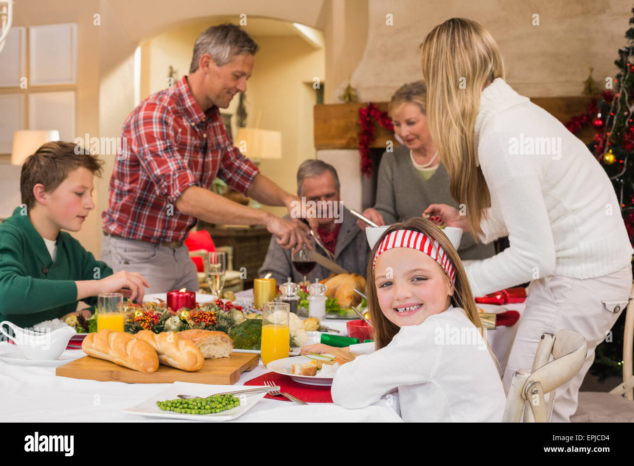 Three generation family having christmas dinner together Stock Photo ...