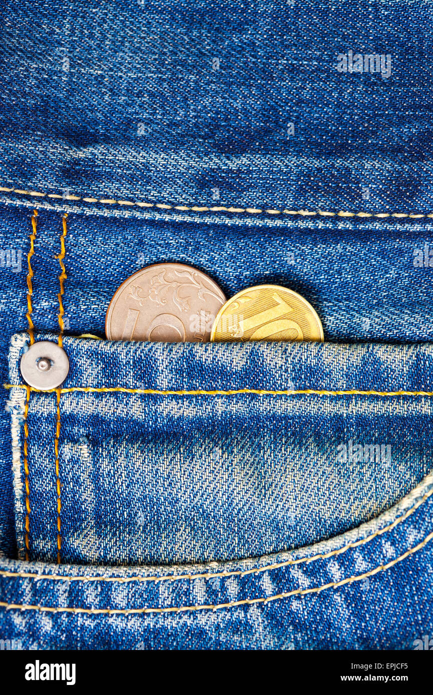 Coins in pocket jeans Stock Photo - Alamy