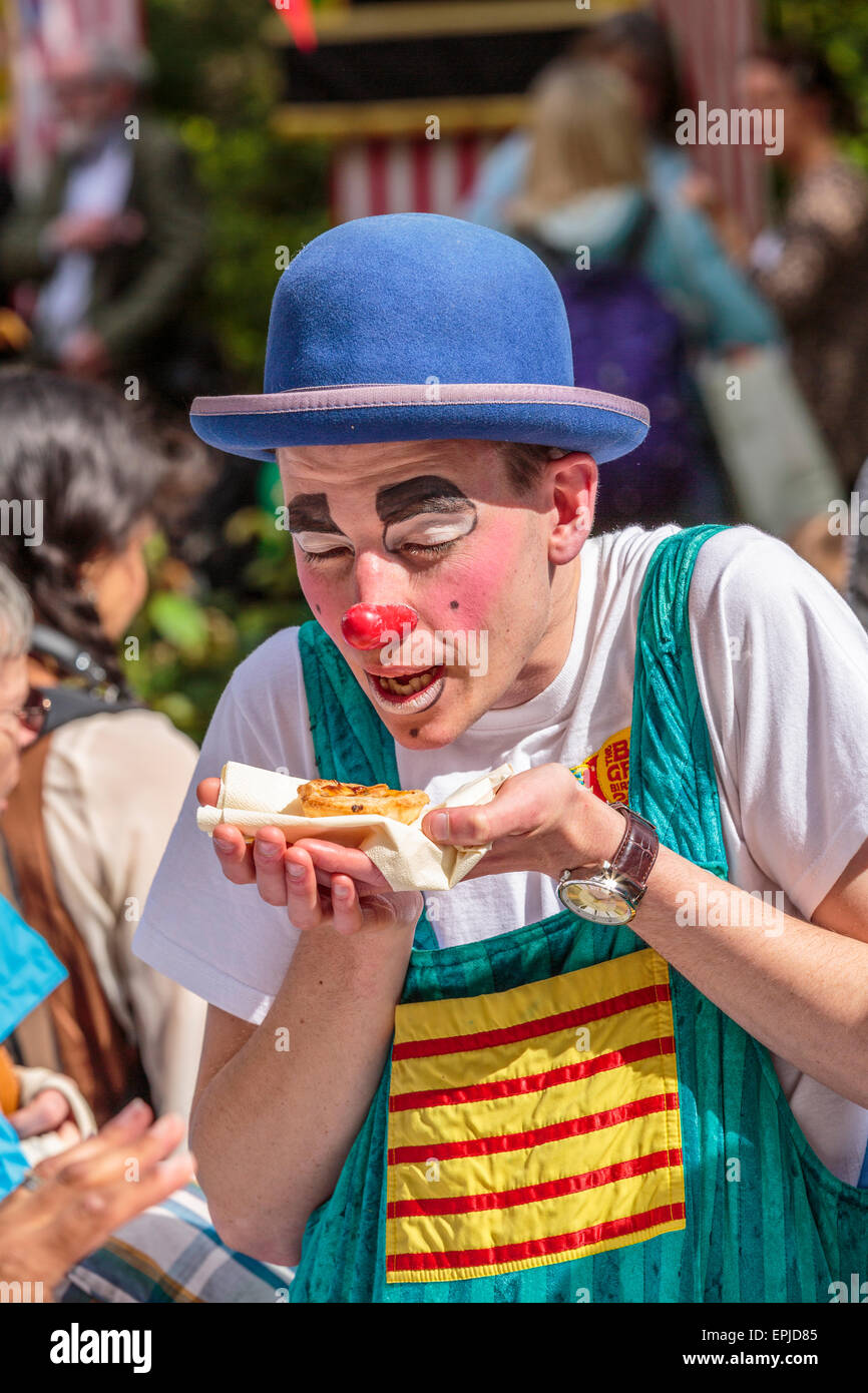 Portrait of a Clown eating a mini pizza Stock Photo - Alamy