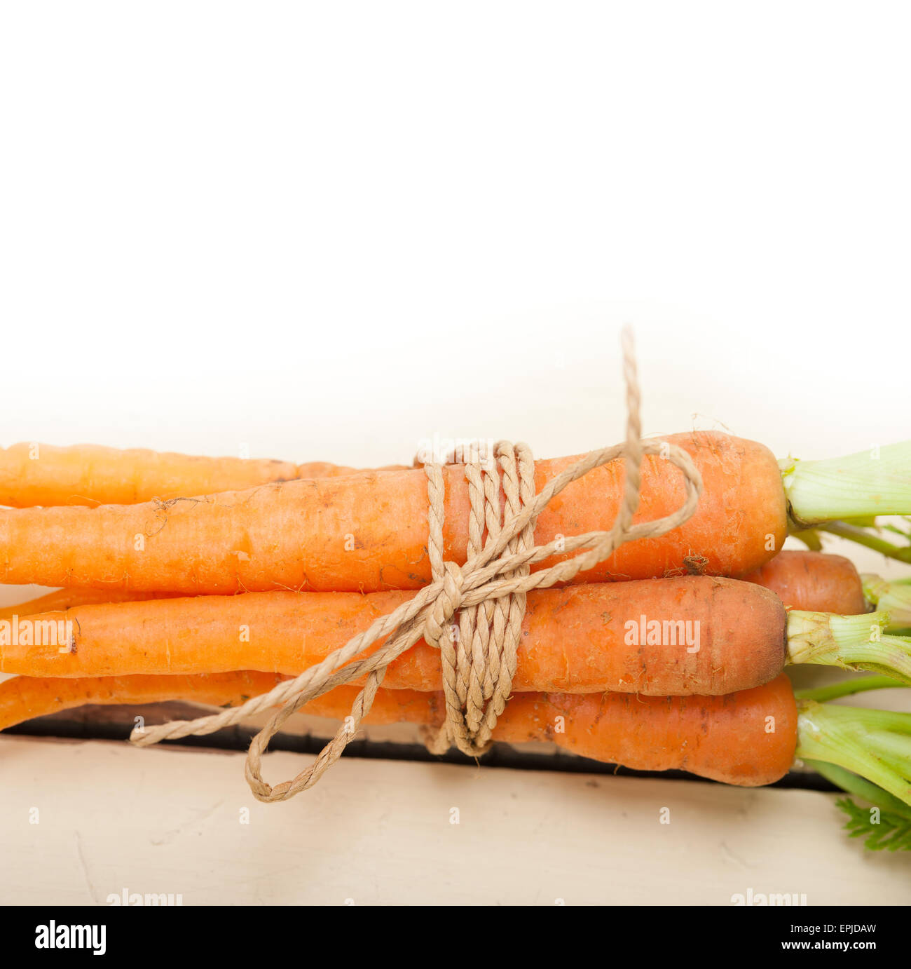 baby carrots bunch tied with rope Stock Photo - Alamy