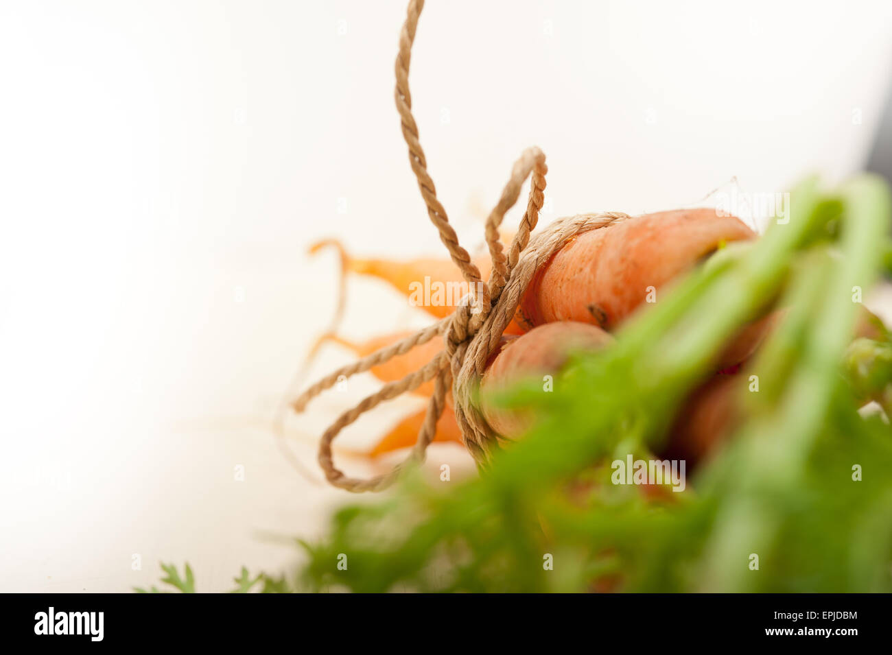 baby carrots bunch tied with rope Stock Photo - Alamy