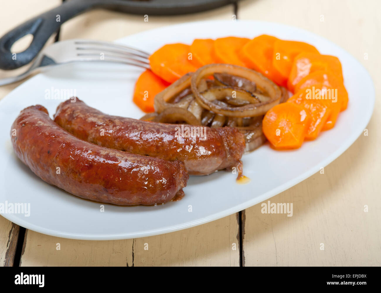 beef sausages cooked on iron skillet Stock Photo - Alamy