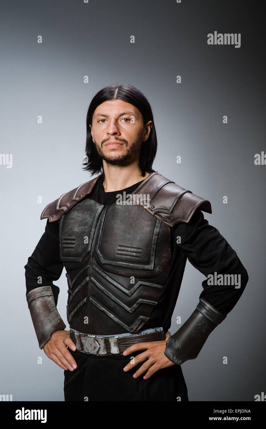 Angry warrior against dark background Stock Photo - Alamy