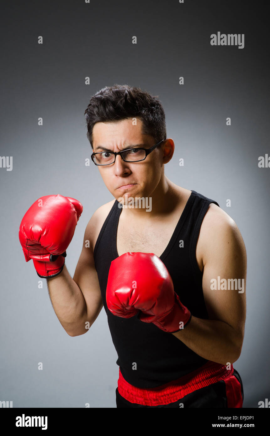 Funny boxer with red gloves against dark background Stock Photo - Alamy