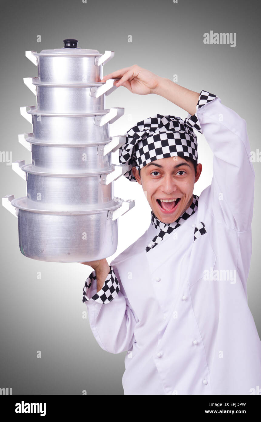 Cook with stack of pots on white Stock Photo - Alamy