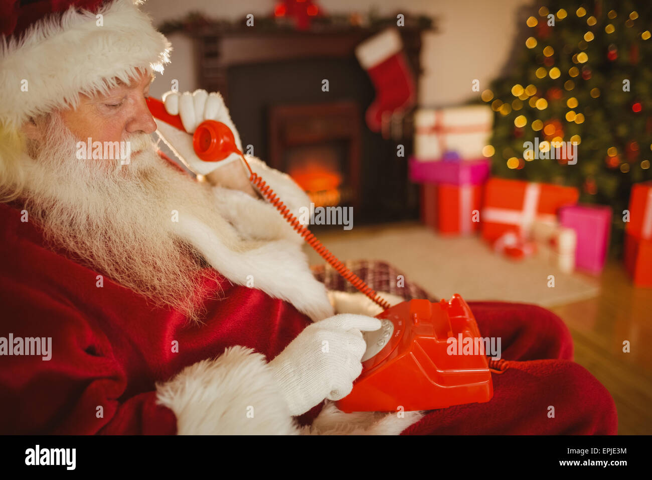 Santa claus making a phone call Stock Photo - Alamy